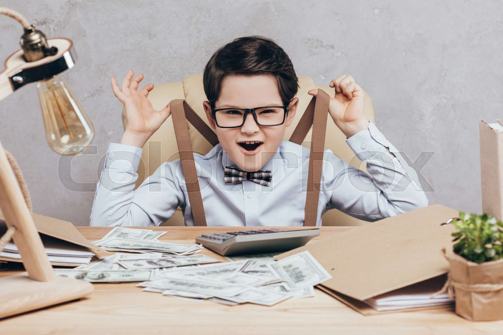 emotional little boy at workplace | Stock image | Colourbox