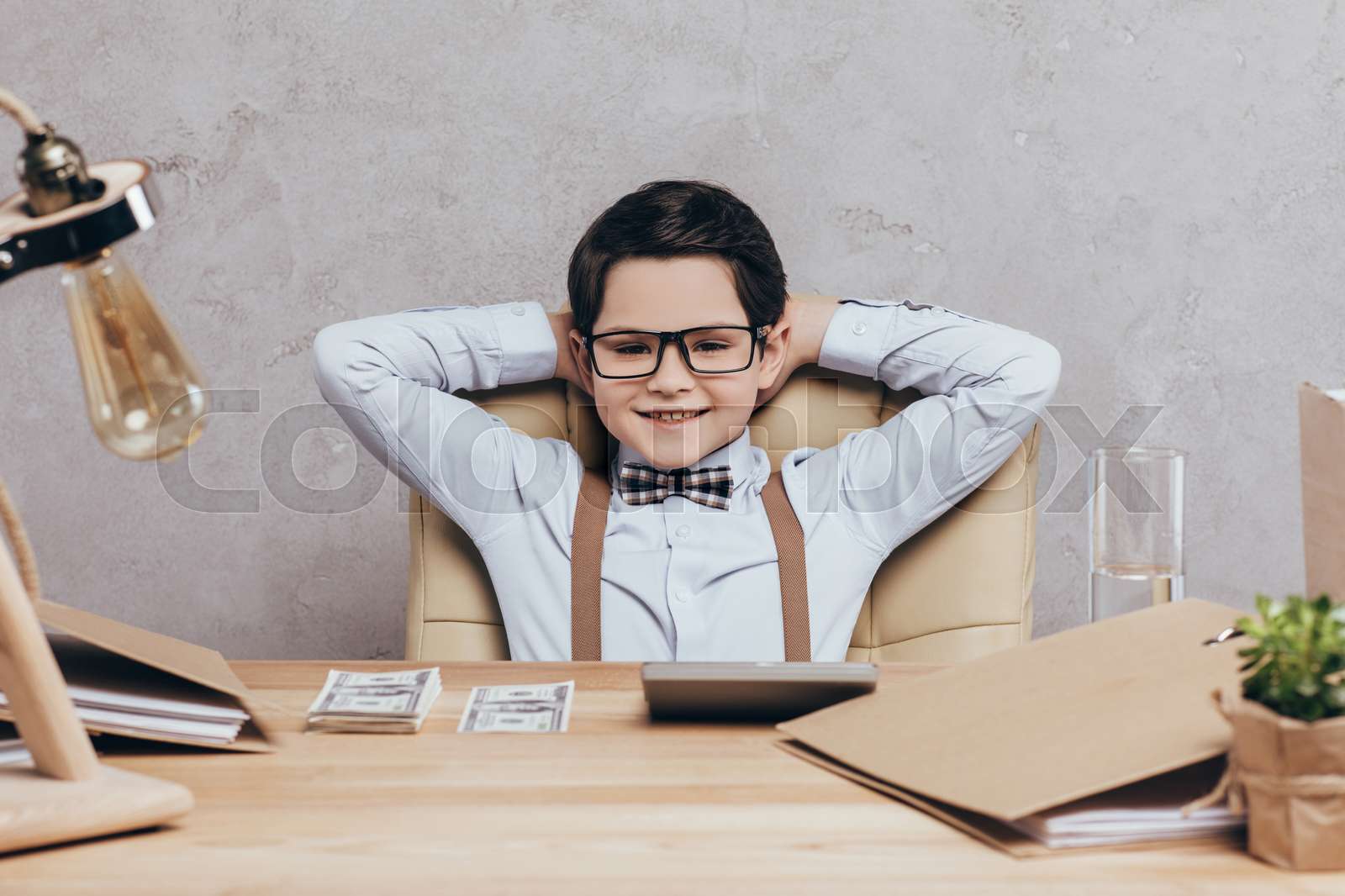 stylish little boy at workplace | Stock image | Colourbox
