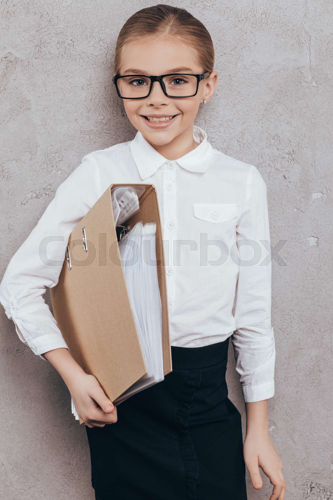 child with folder in hand | Stock image | Colourbox