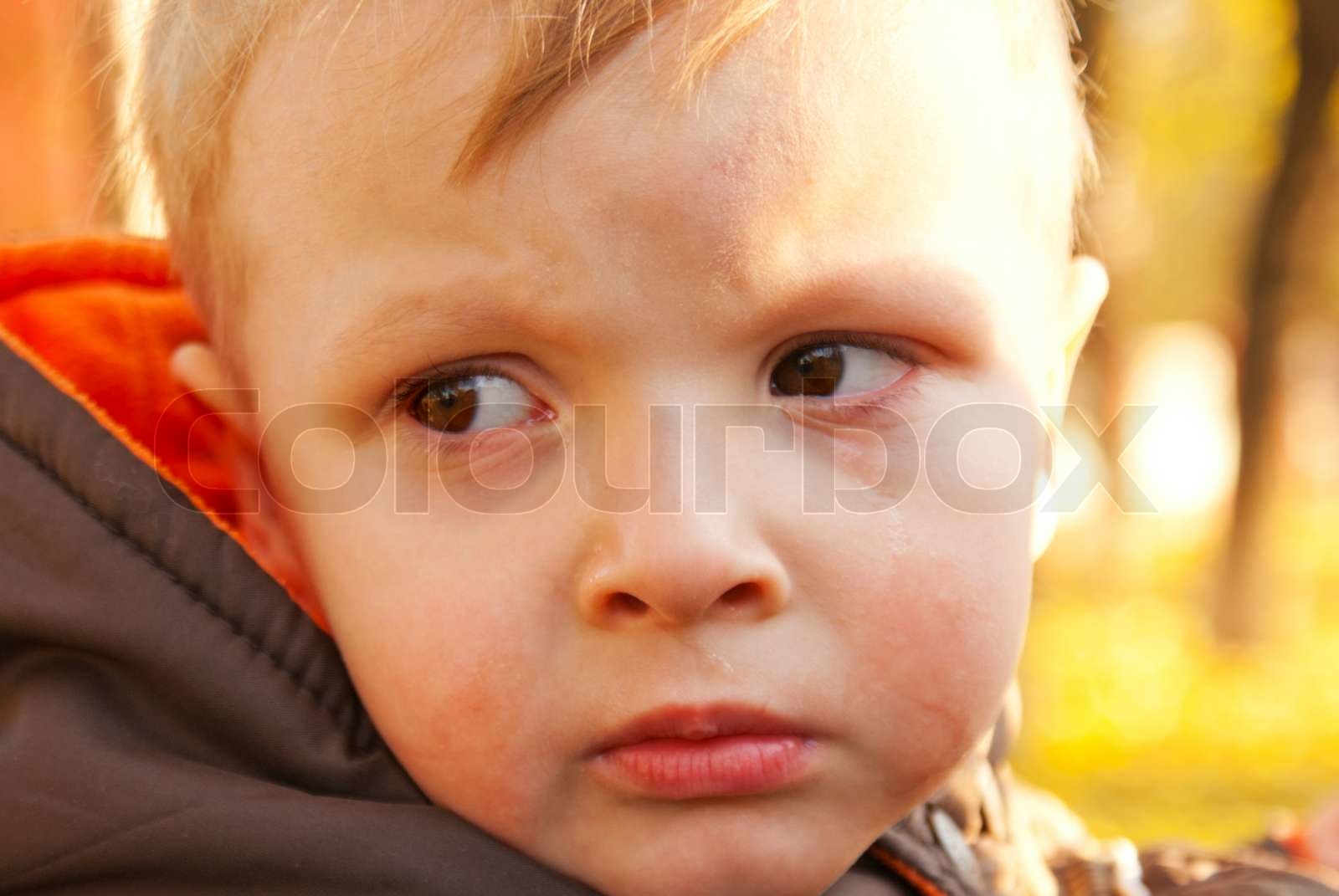 Little boy crying outdoors | Stock image | Colourbox