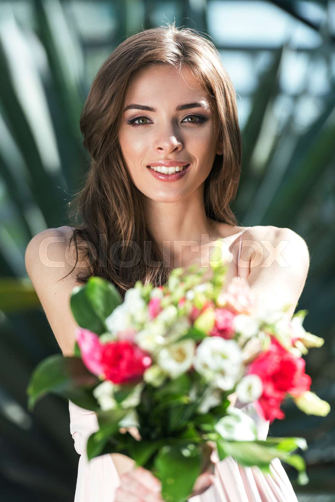 Beautiful Woman Holding Flowers