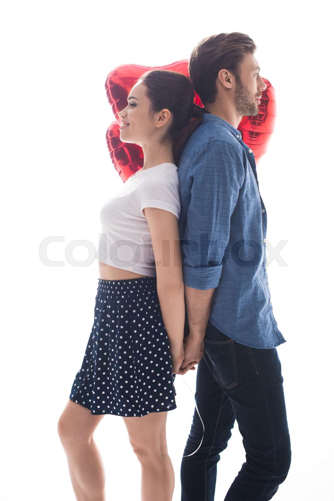 couple standing back to back | Stock image | Colourbox