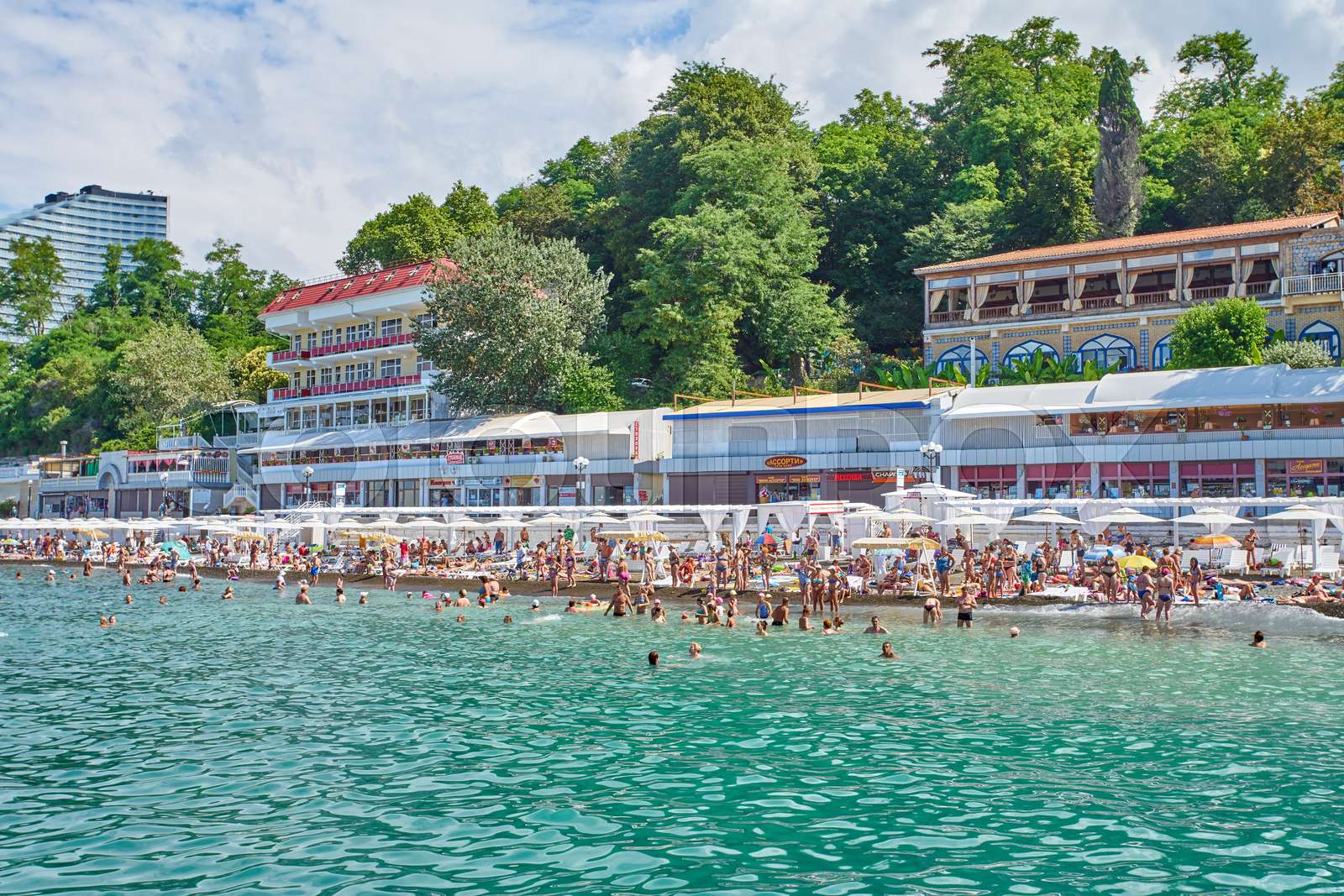 Sochi, Russia - 06 July, 2017.People swim and sunbathe at the city ...
