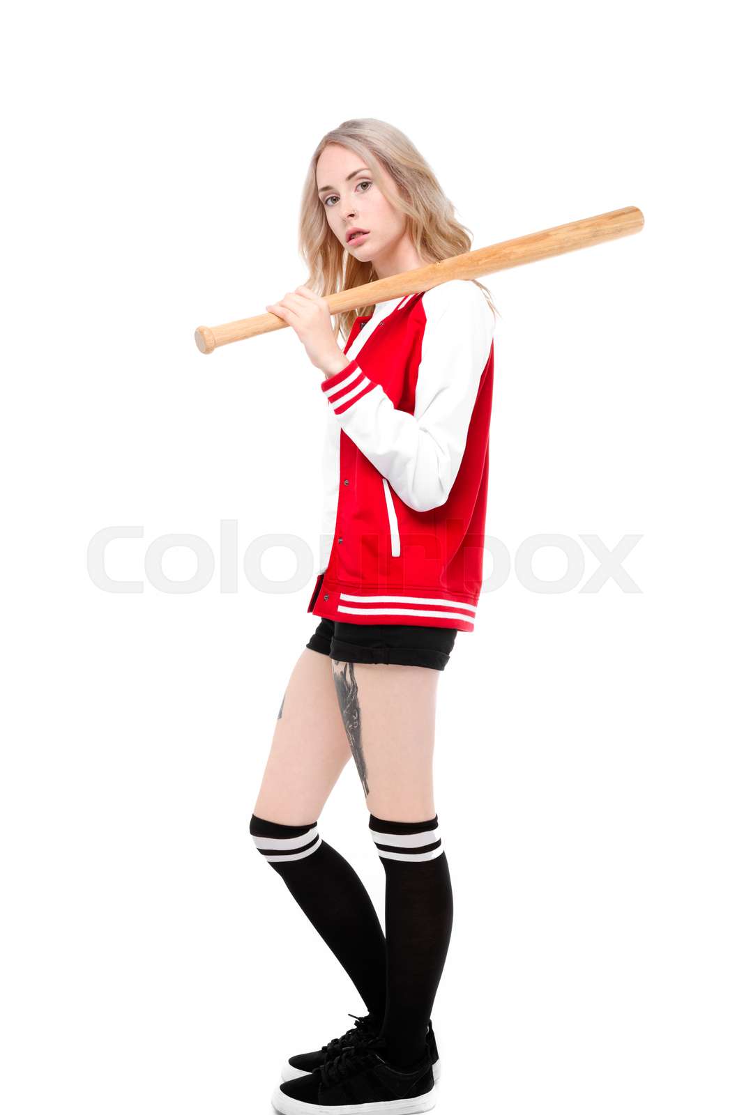 Woman posing with baseball bat | Stock image | Colourbox