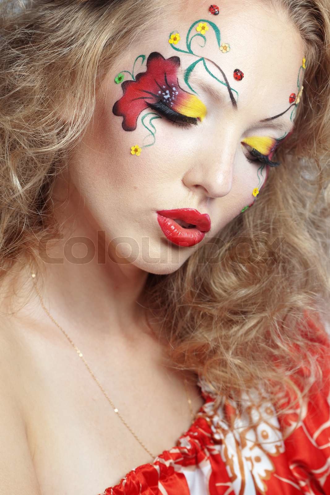 Stylish model with face paint | Stock image | Colourbox