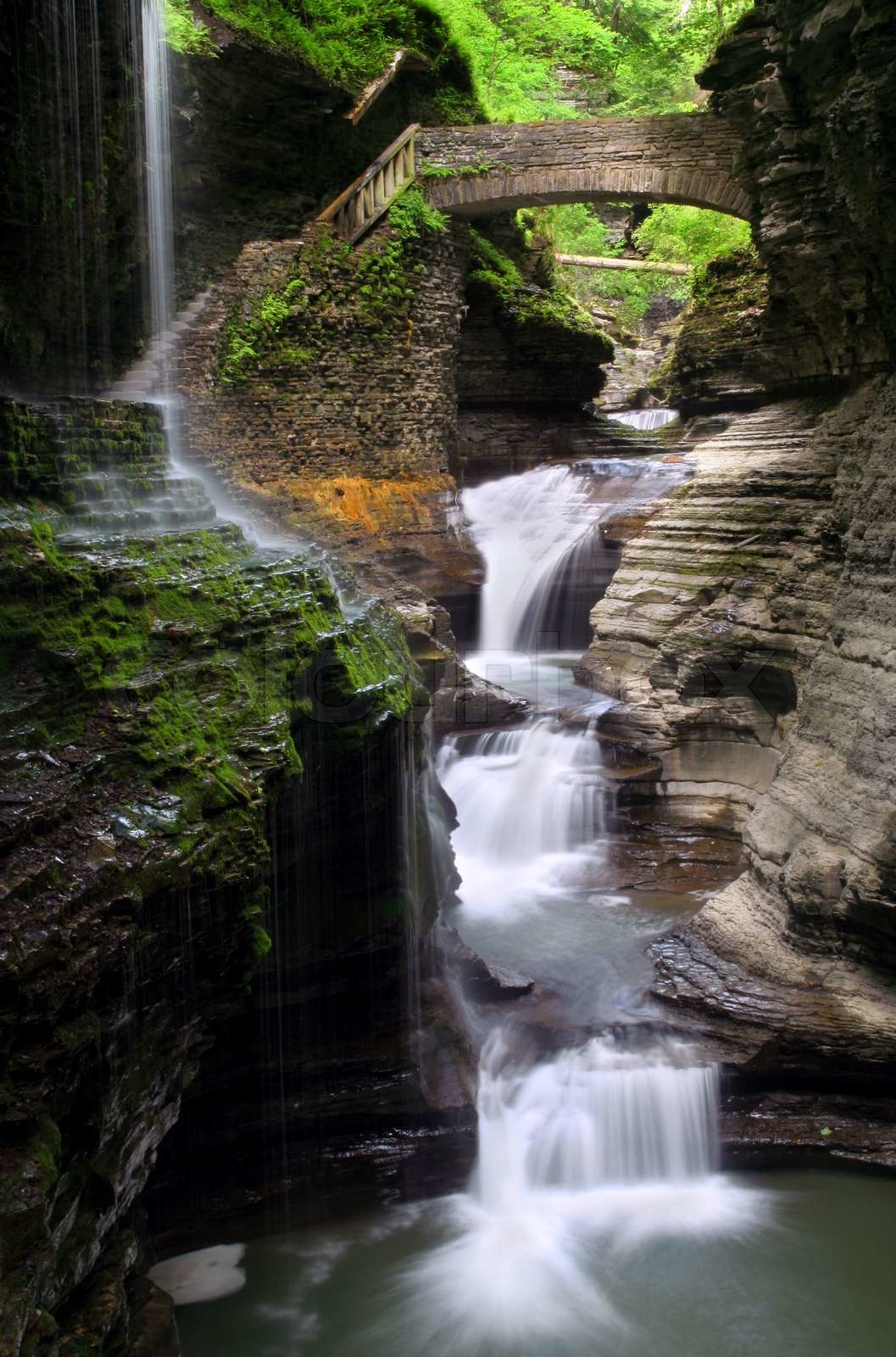 Waterfall cascading over rocks | Stock image | Colourbox