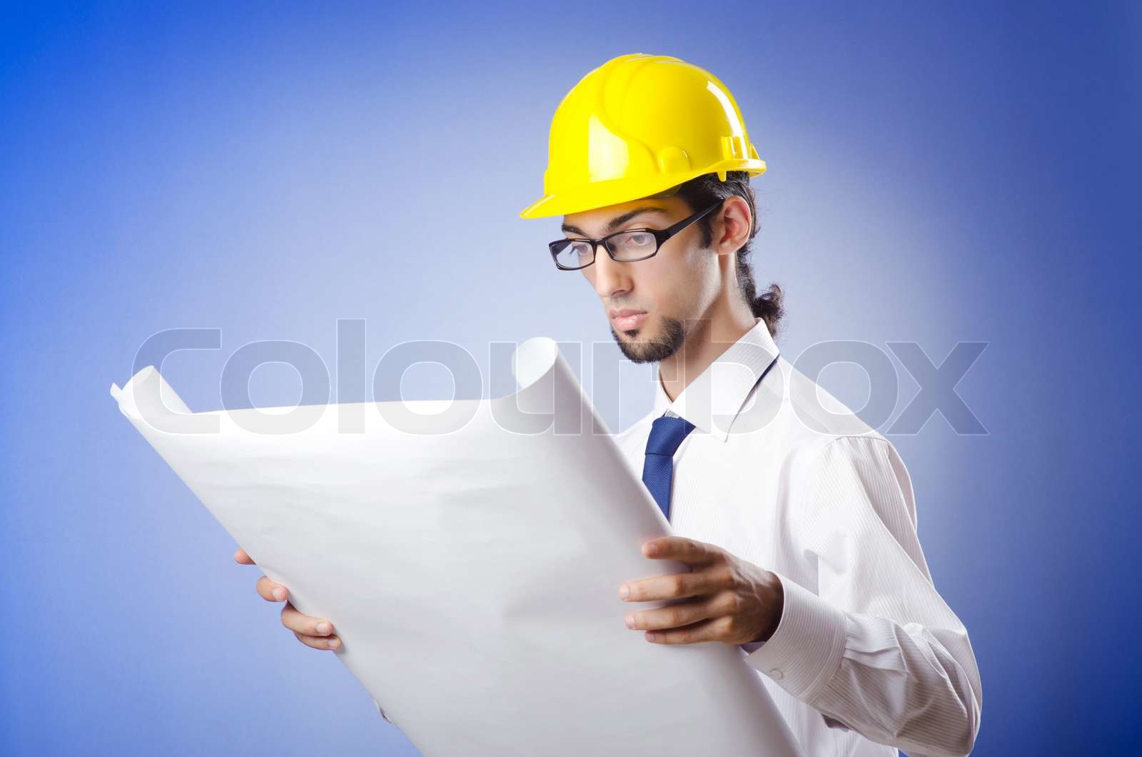 Young engineer working with drawings | Stock image | Colourbox