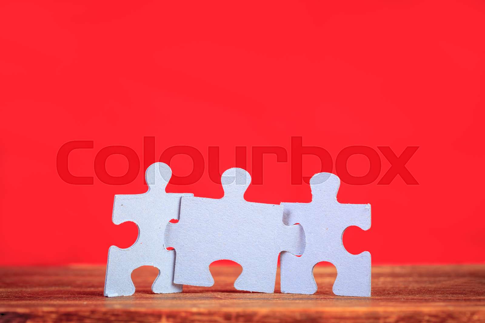 Three jigsaw puzzle pieces | Stock image | Colourbox