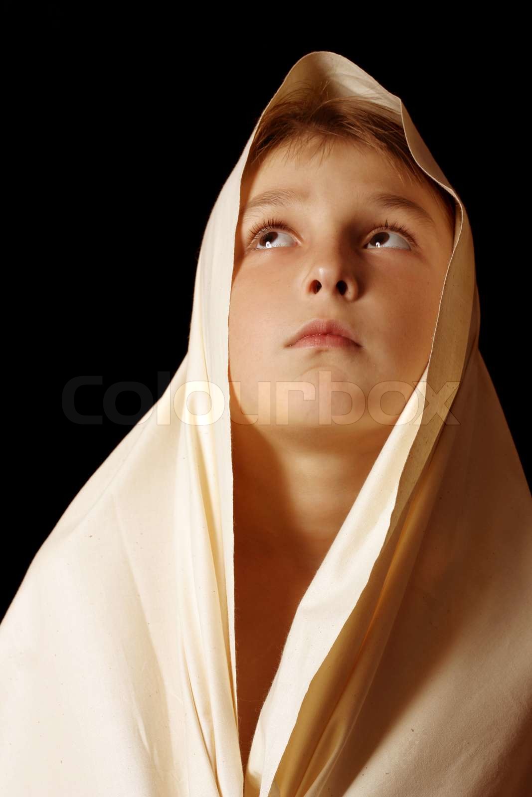 Humble child in simple cloth lifting up eyes to heaven | Stock image ...