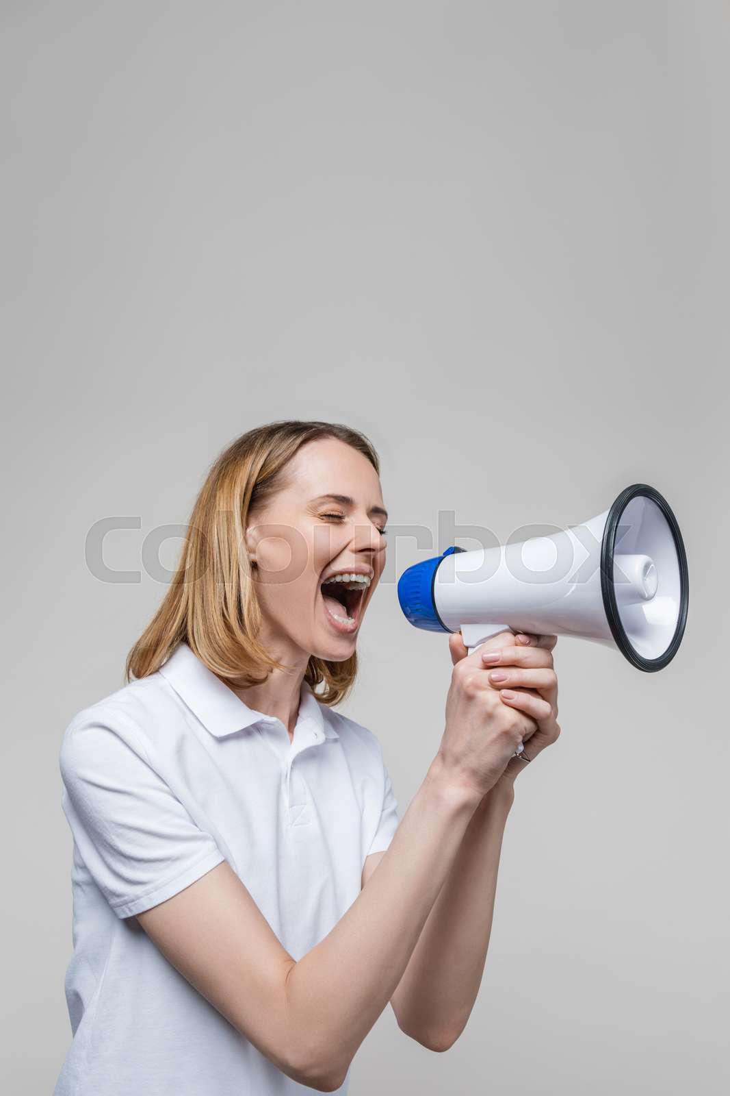 woman screaming into megaphone | Stock image | Colourbox