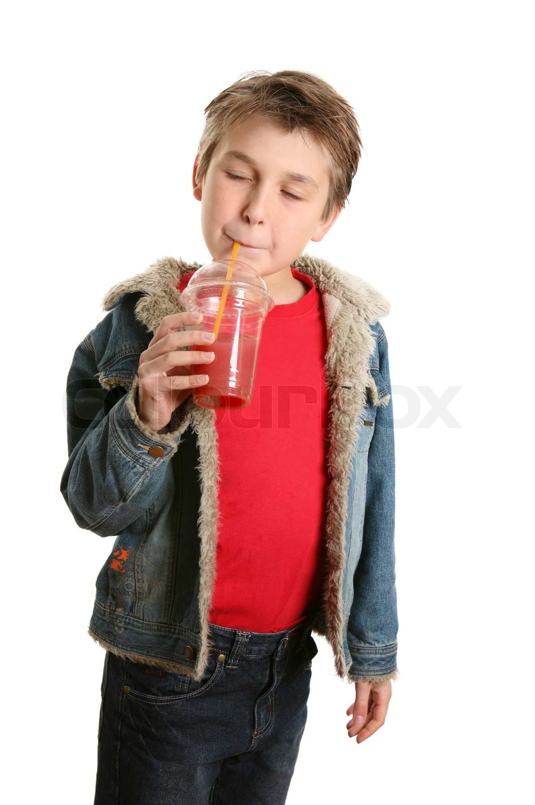 Child sipping a freshly made fruit juice through a straw | Stock image ...