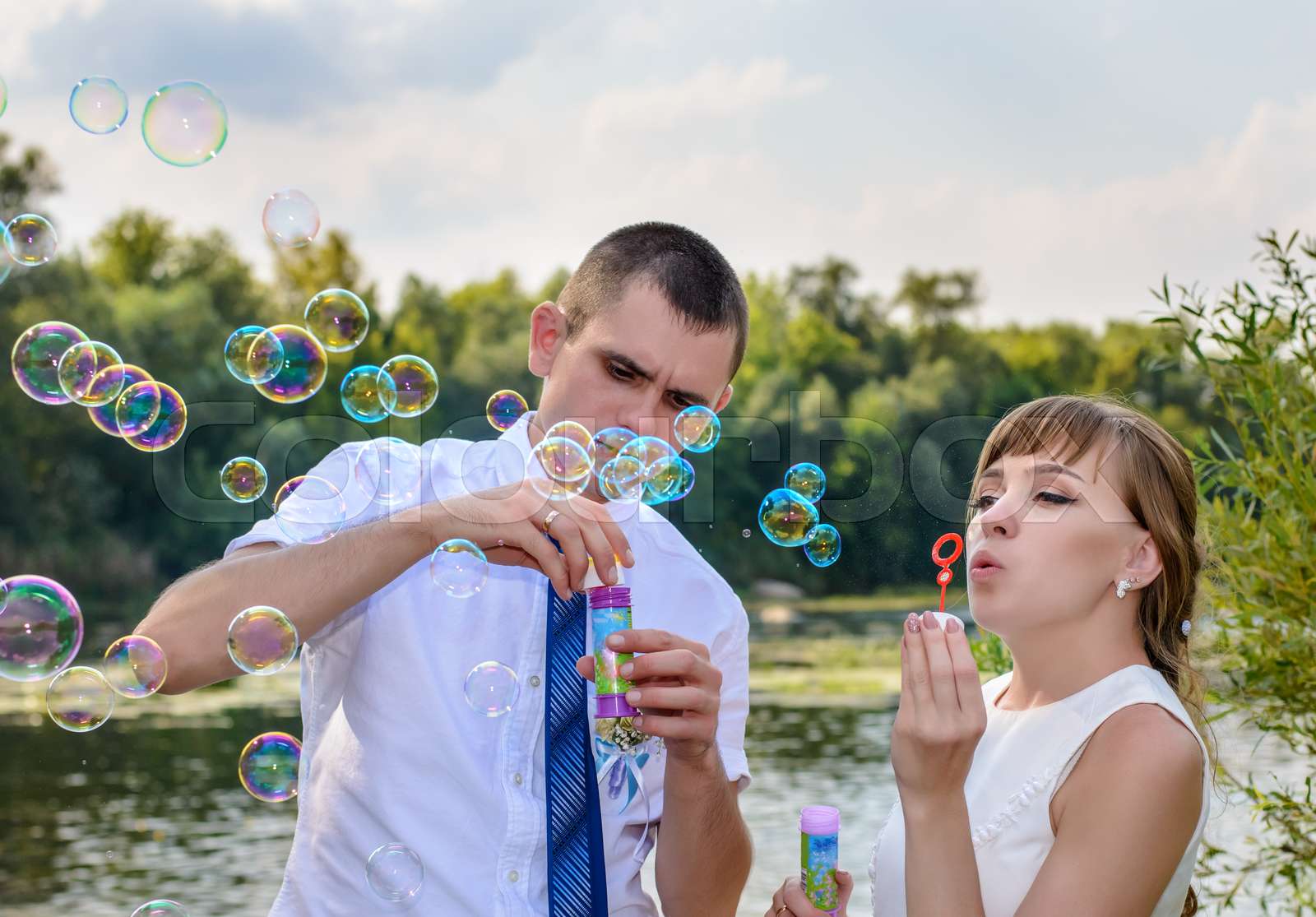 Newlywed young bride and groom celebrating | Stock image | Colourbox
