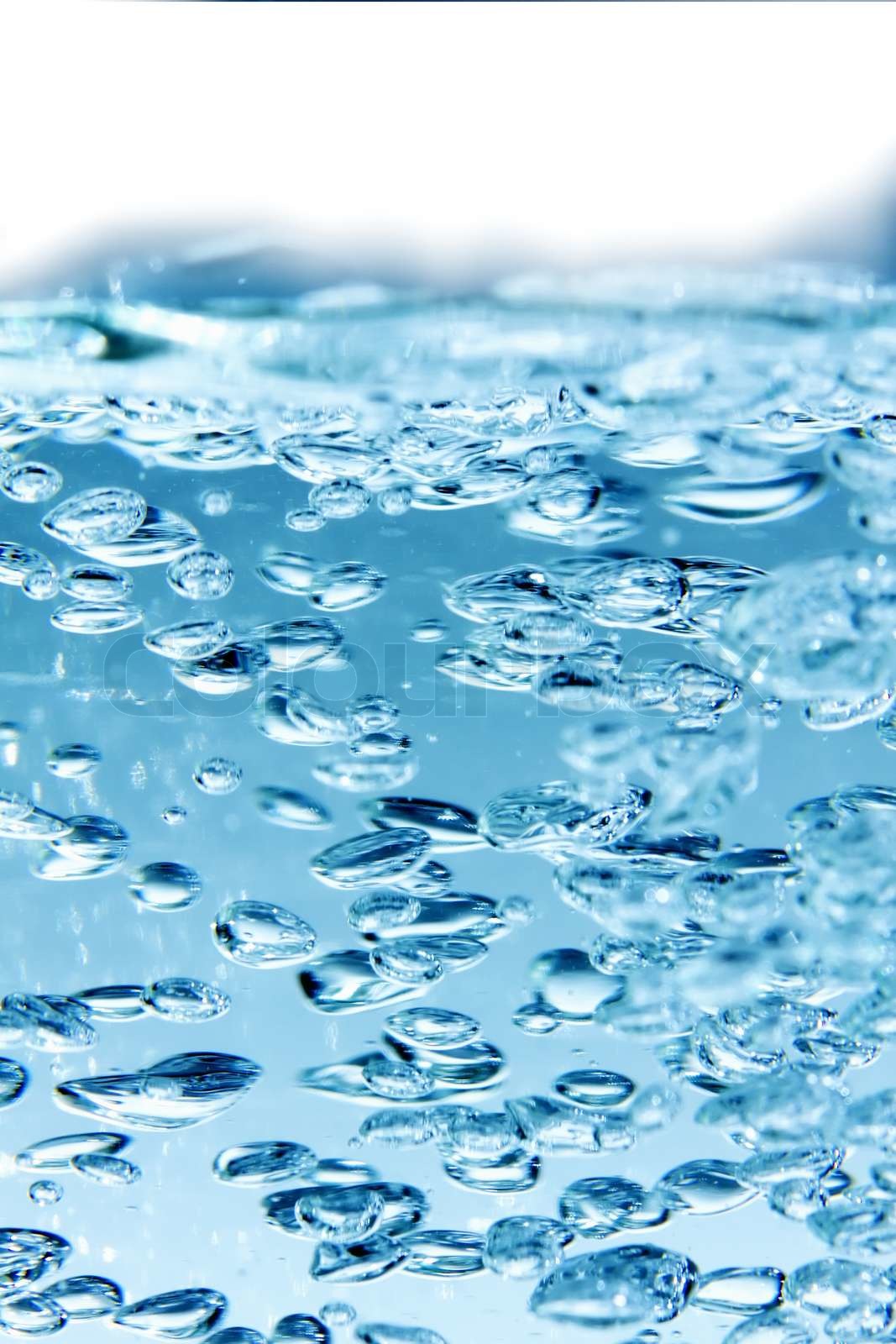 Wasserblasen und Handeln über weißem Hintergrund | Stock Bild | Colourbox