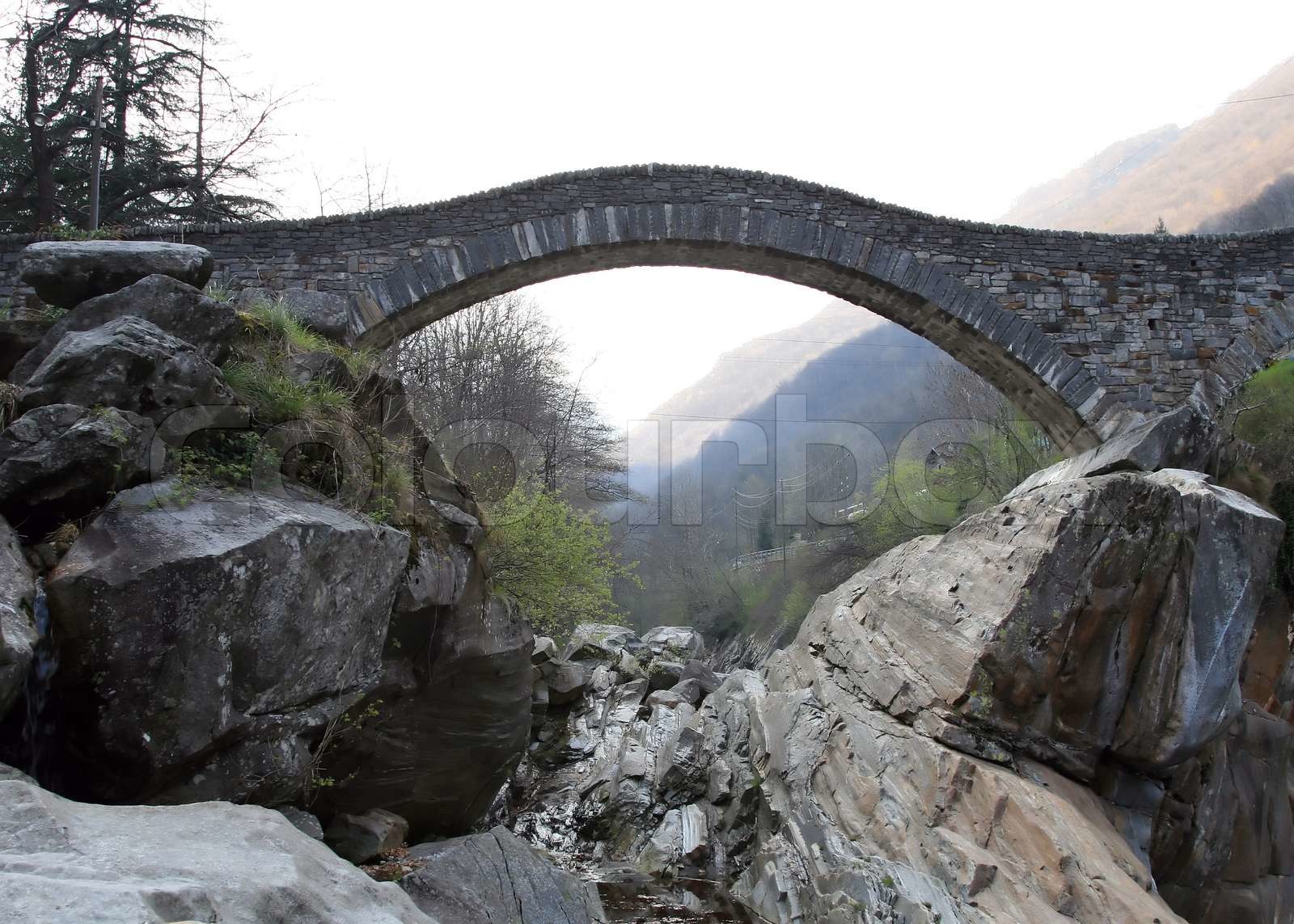 Ancient arch bridge in Lavertezzo, Switzerland | Stock image | Colourbox