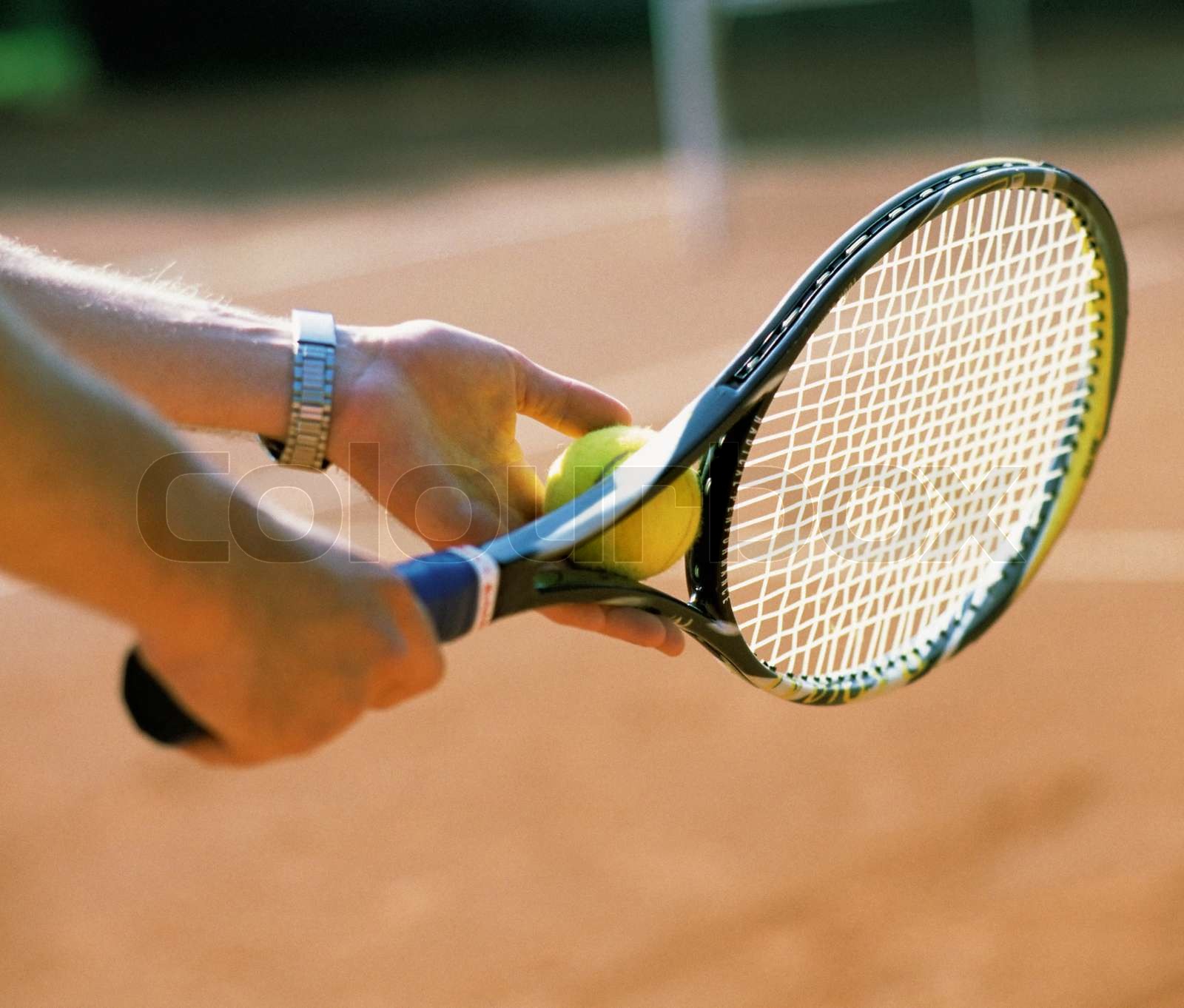 Man Serving a Tennis Ball close up | Stock image | Colourbox
