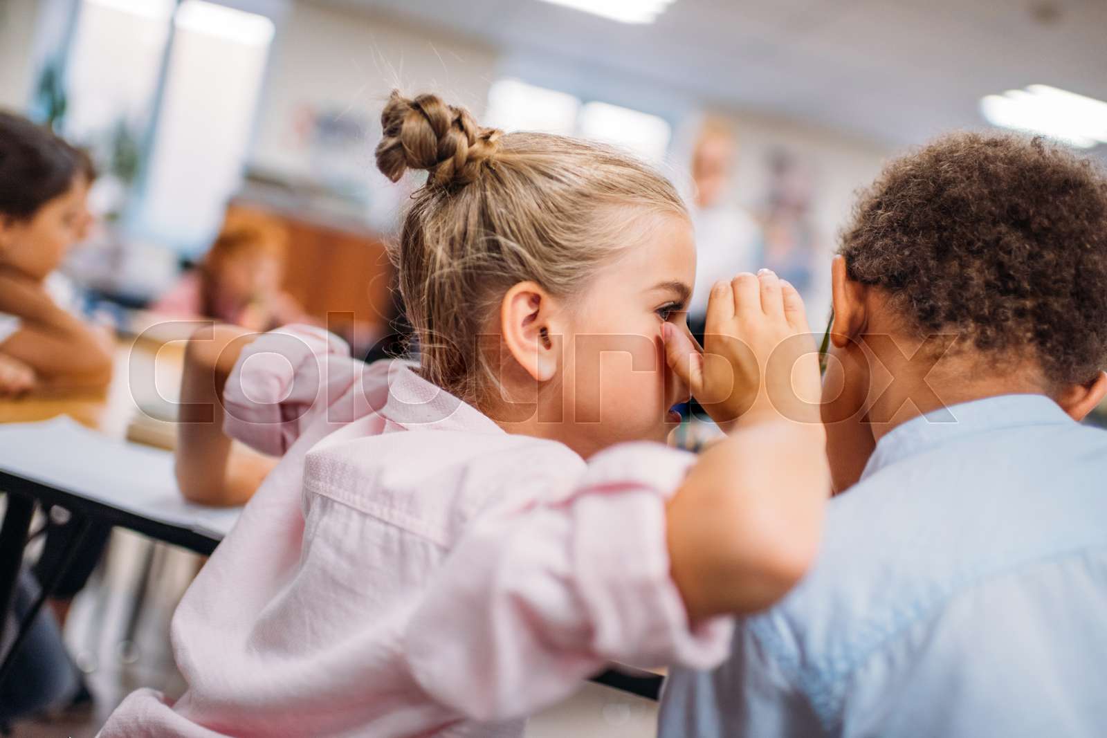 kids gossiping at school | Stock image | Colourbox