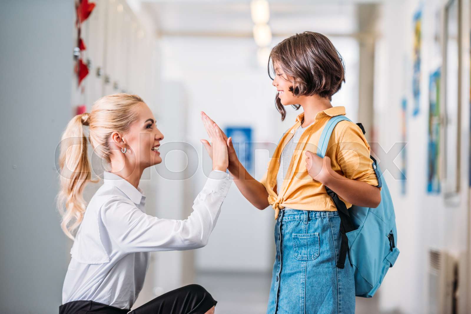 teacher giving high five to schoolgirl | Stock image | Colourbox teacher giving high five to schoolgirl | Stock image | Colourbox