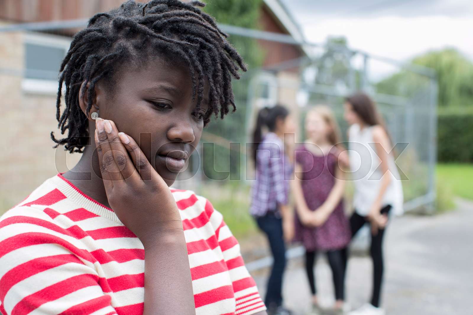 Sad Teenage Girl Feeling Left Out By Friends | Stock image | Colourbox