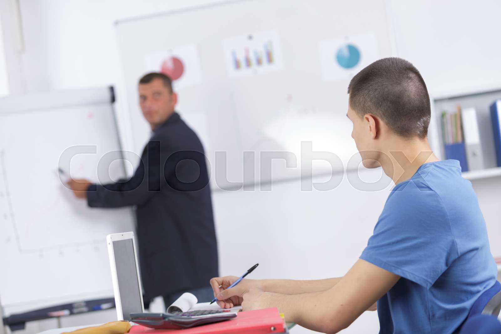 male teacher tutor near whiteboard screen giving lesson | Stock image ...