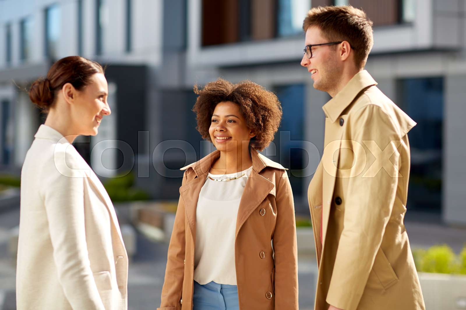 group of people talking on city street | Stock image | Colourbox