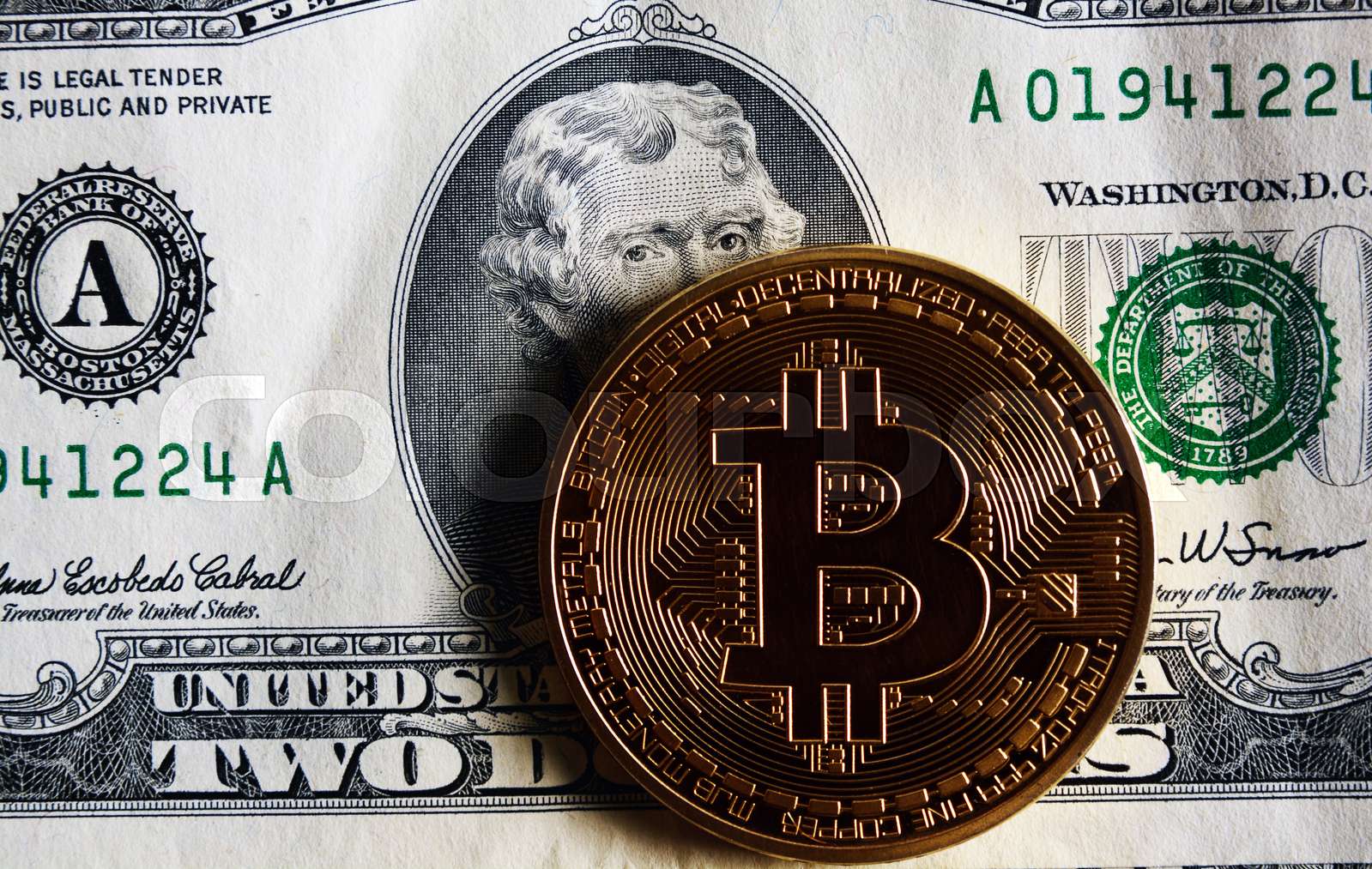 bitcoin on two dollar bill | Stock image | Colourbox