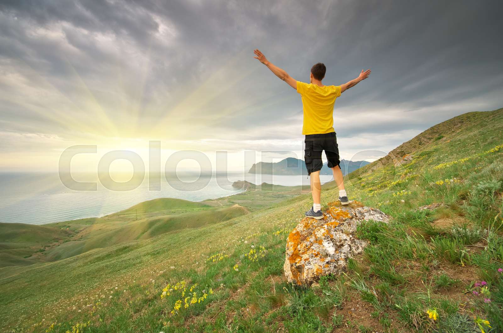 Man rising to sun. | Stock image | Colourbox