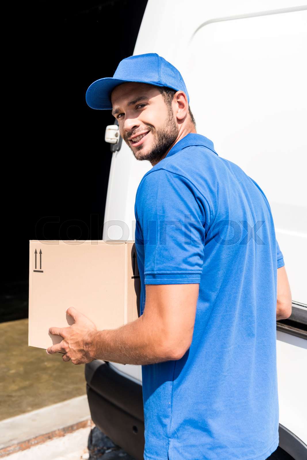 delivery man with box | Stock image | Colourbox