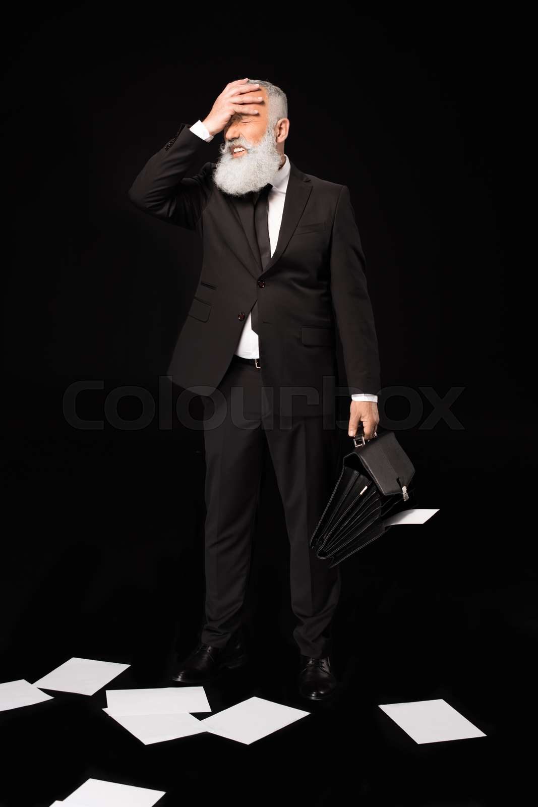 businessman placing hand across face | Stock image | Colourbox