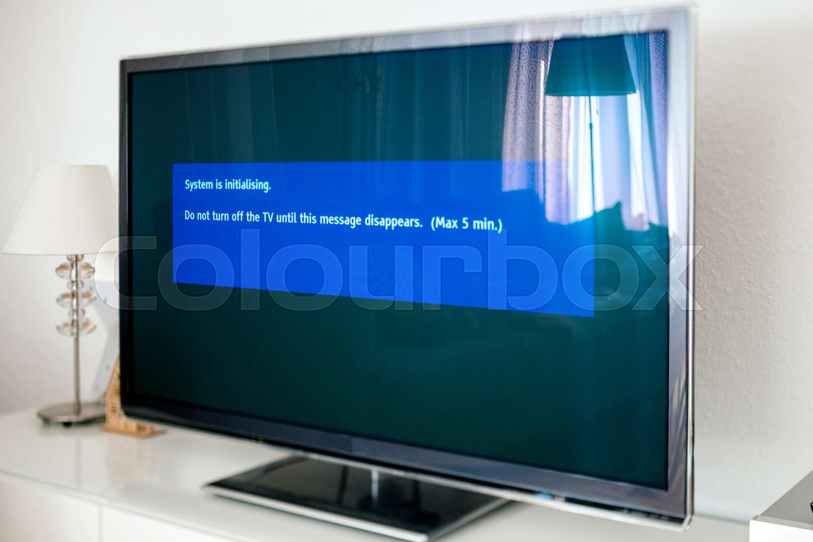 Do not turn the tv off during update | Stock image | Colourbox