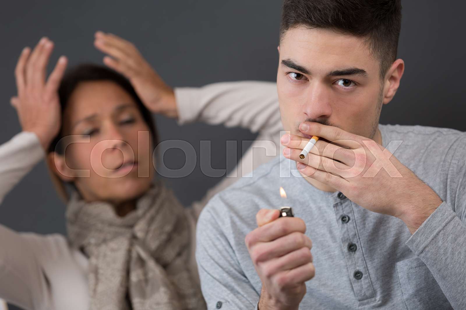 frustrated mother and son smoking | Stock image | Colourbox