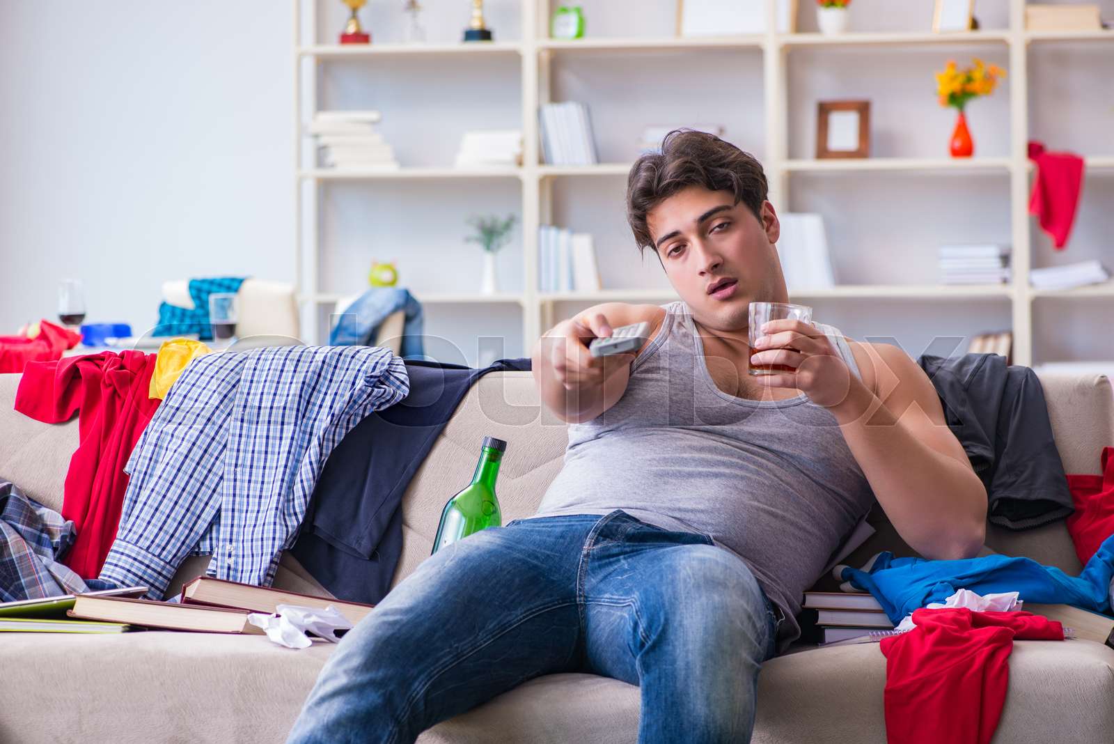 Young man student drunk drinking alcohol in a messy room | Stock image ...