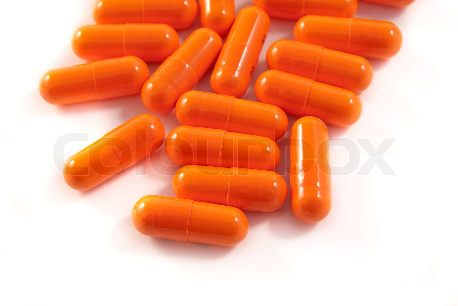 bunch of orange pills | Stock image | Colourbox