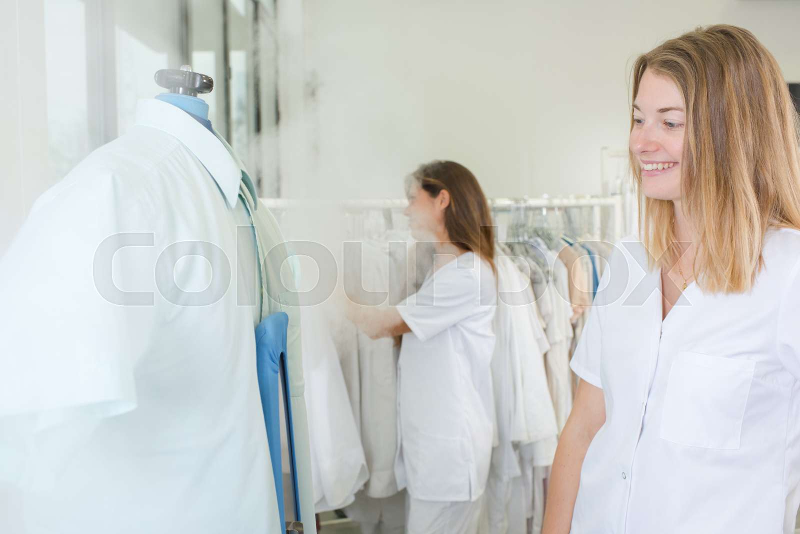 happy laundry worker | Stock image | Colourbox