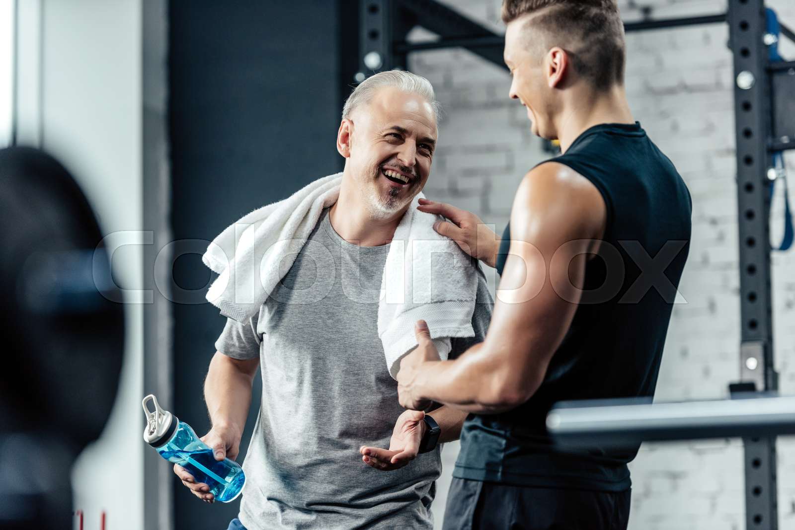sportsman shaking hands with trainer | Stock image | Colourbox