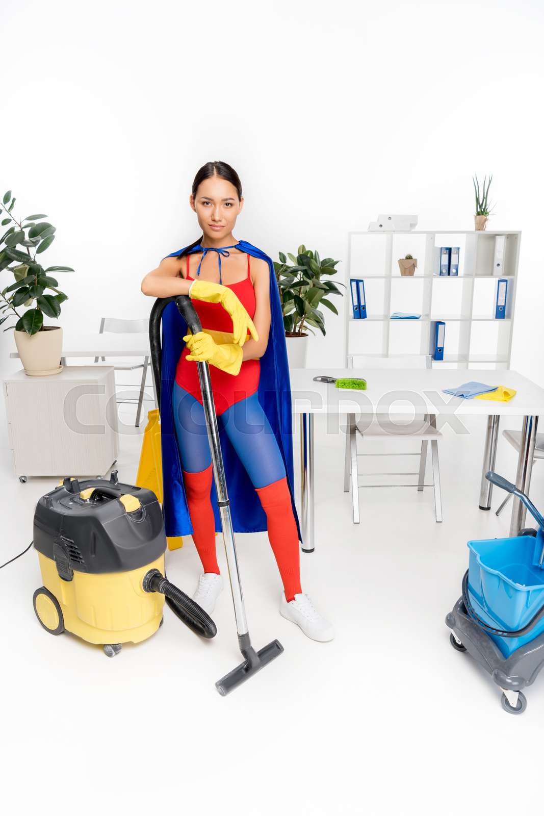 superhero with vacuum cleaner | Stock image | Colourbox