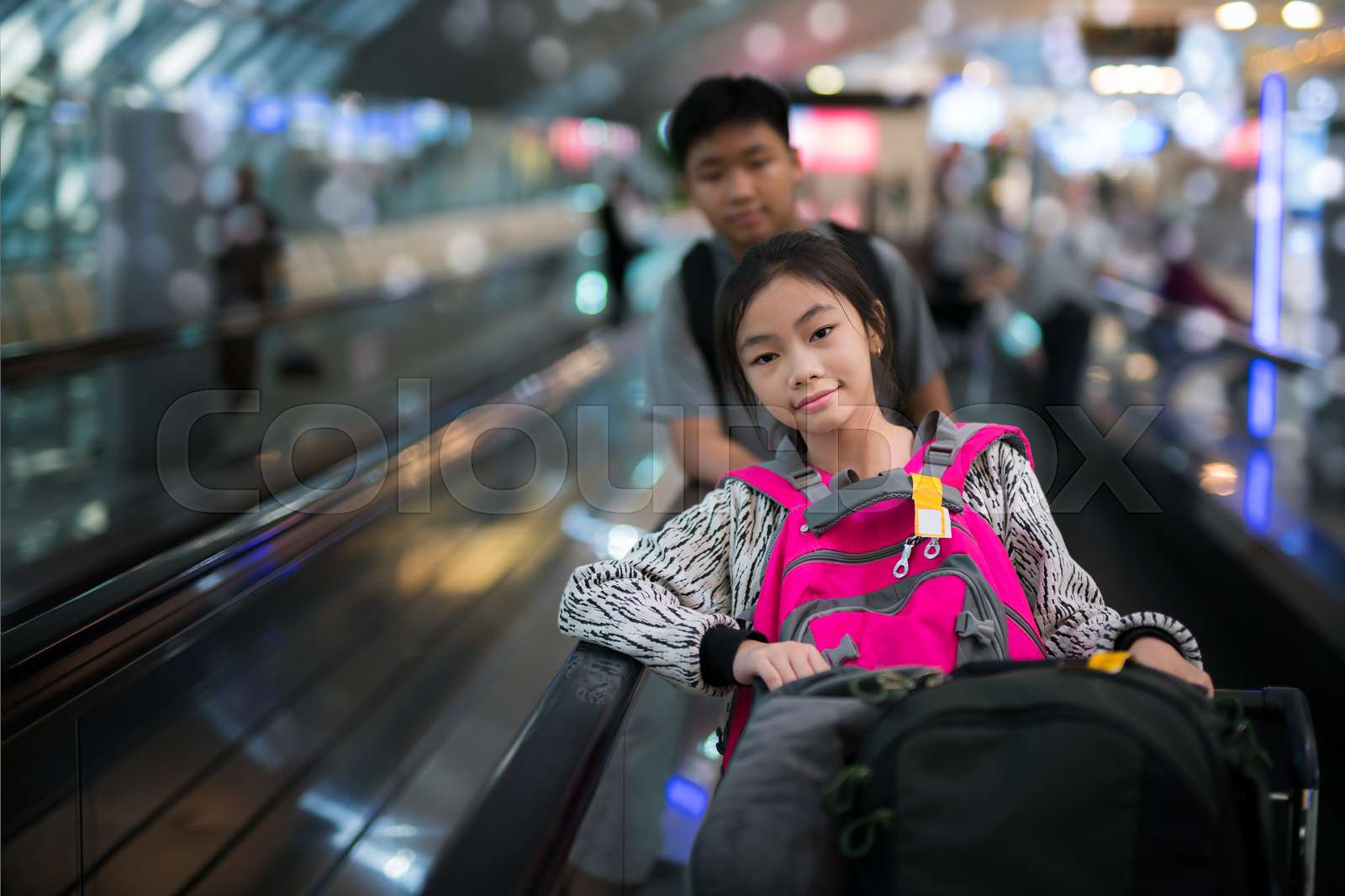 Asian student transit between flight in international airport | Stock ...