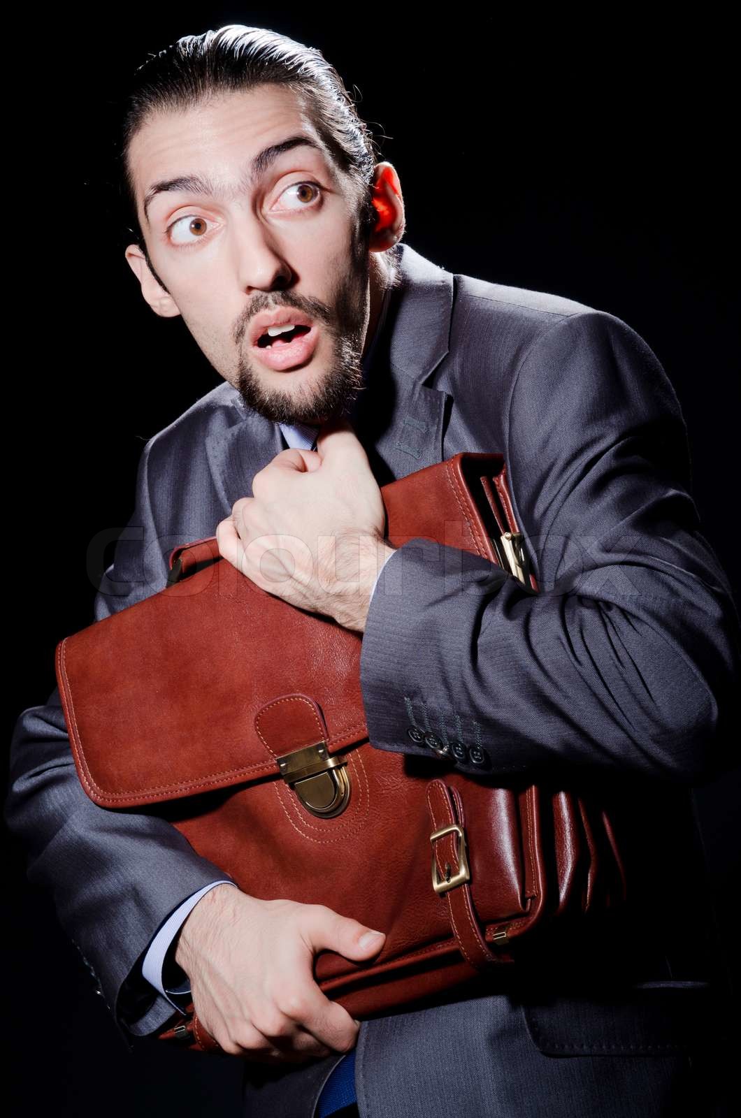 Business spy with briefcase | Stock image | Colourbox