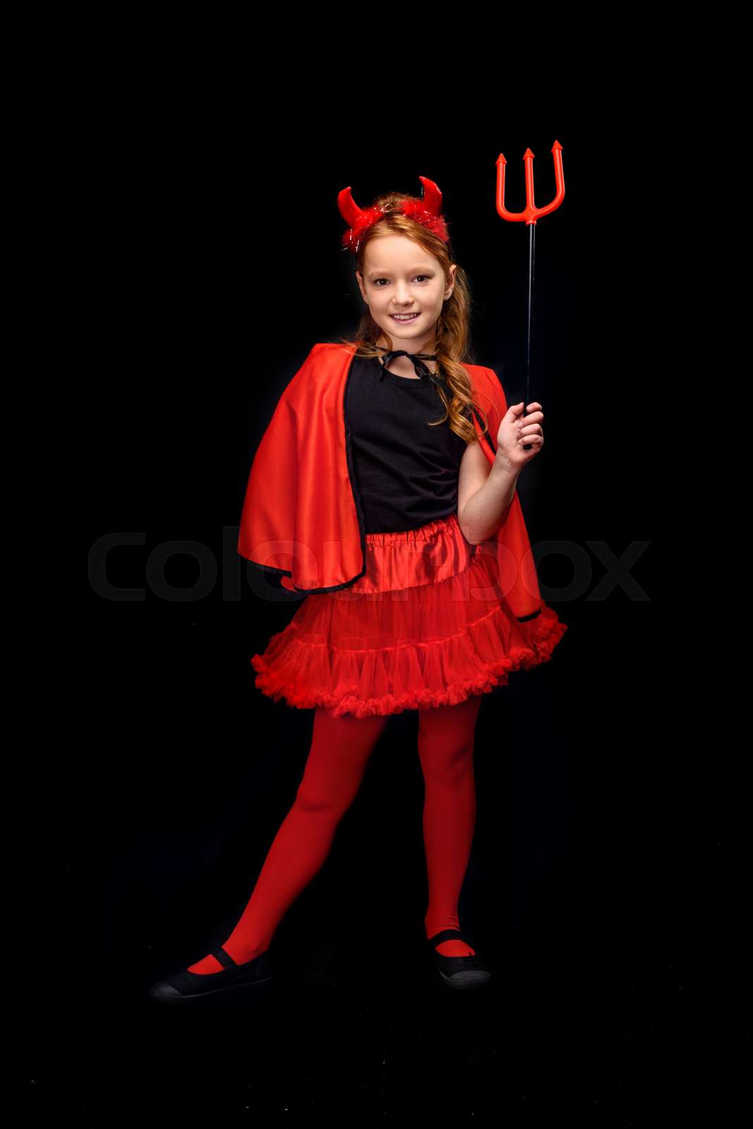 child in costume of devil with pitchfork | Stock image | Colourbox