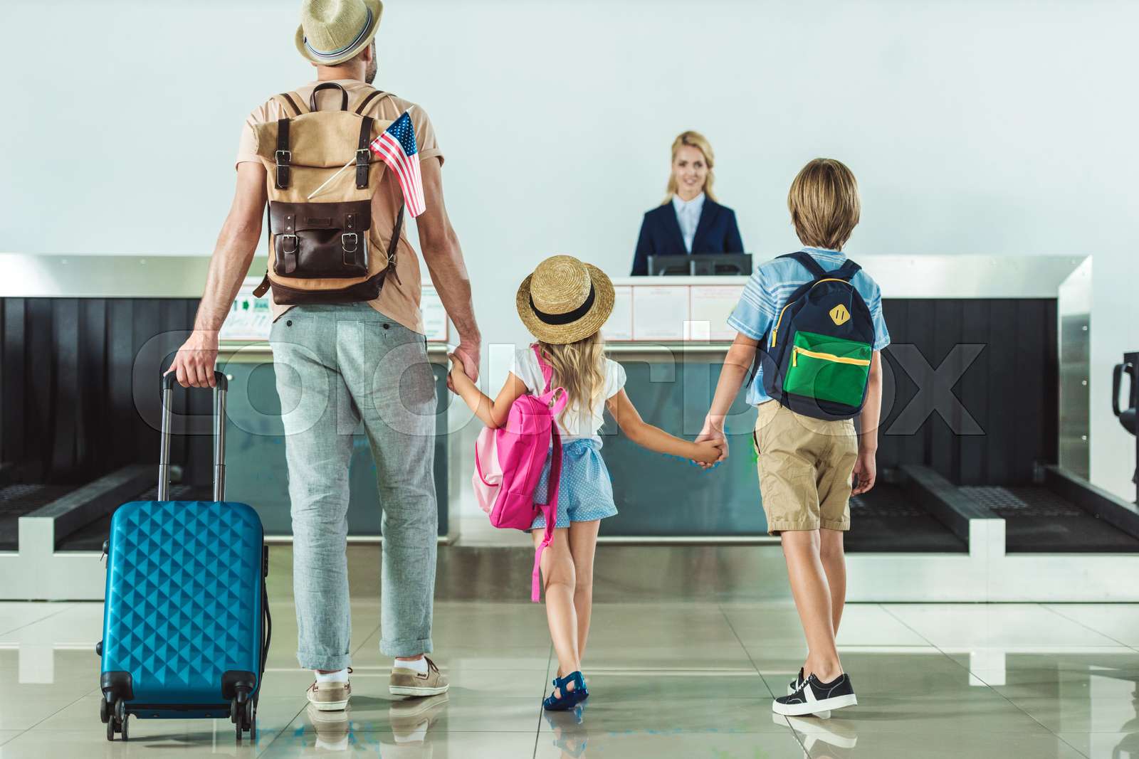 family going to check in desk | Stock image | Colourbox