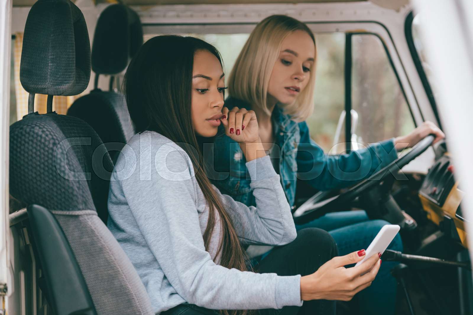 multiethnic girls driving minivan | Stock image | Colourbox
