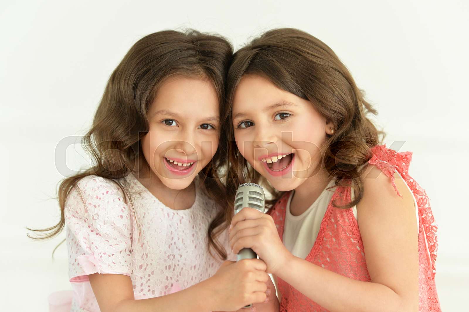 little girls singing with microphone | Stock image | Colourbox