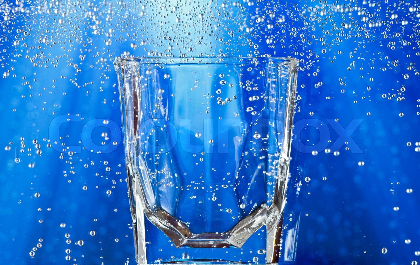 glass in the water covered with bubbles | Stock image | Colourbox