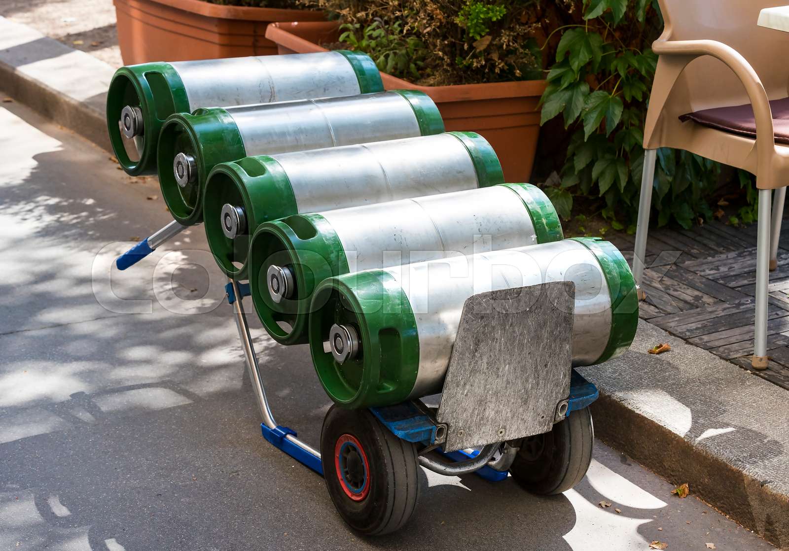 A cart loaded with kegs and beer on a city street | Stock image | Colourbox