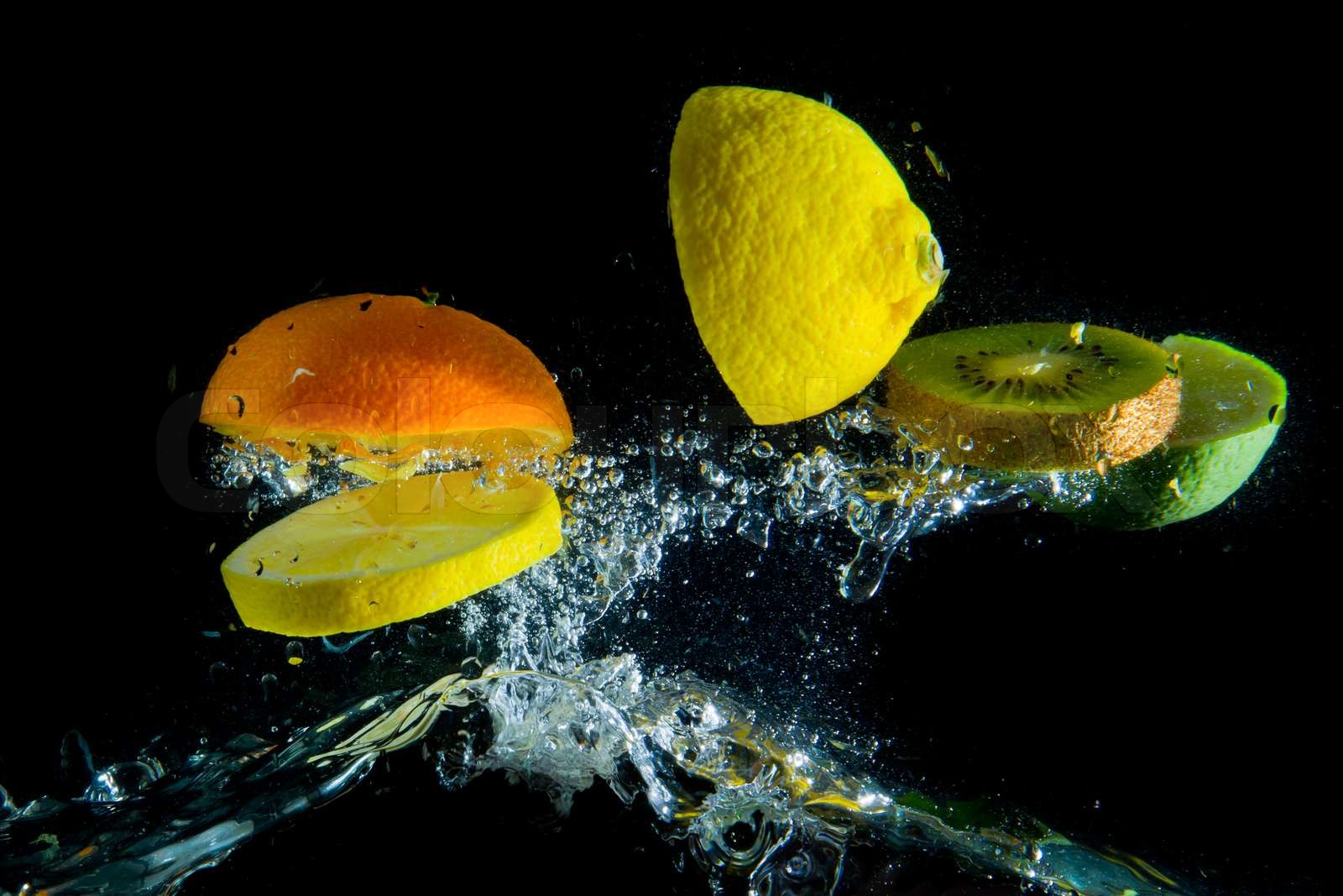 fruit splashing in the water | Stock image | Colourbox