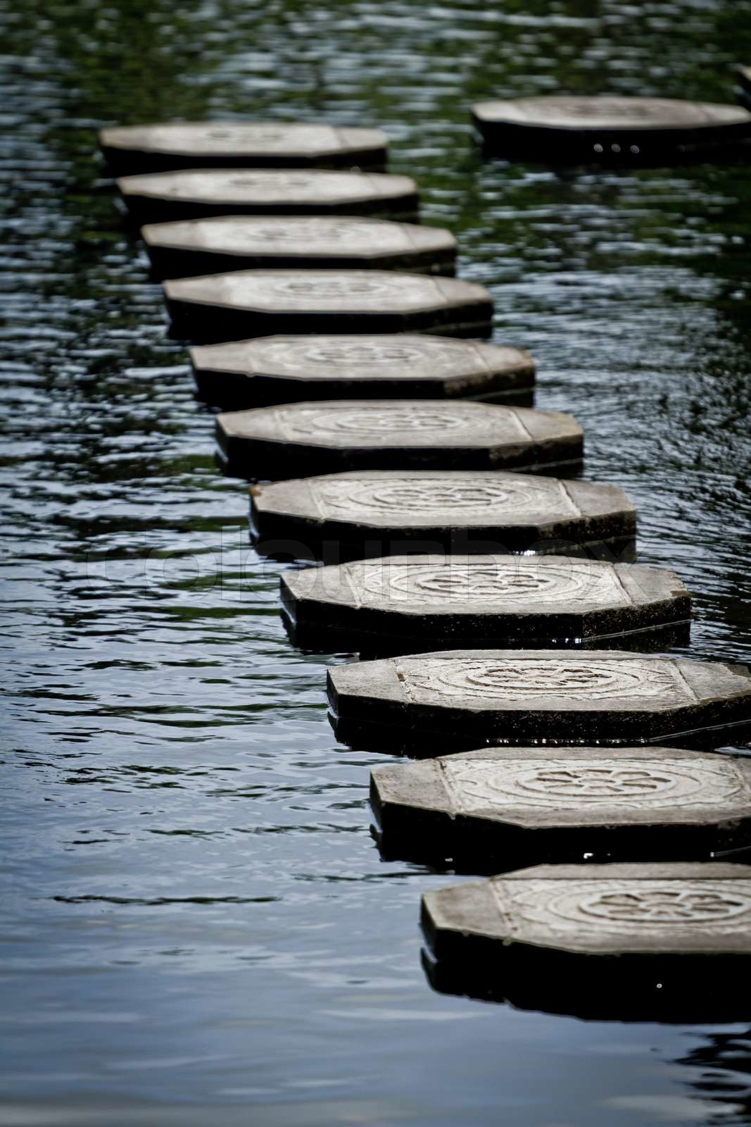 stone steps floating on the water, Tirtagangga water palace, Bali ...