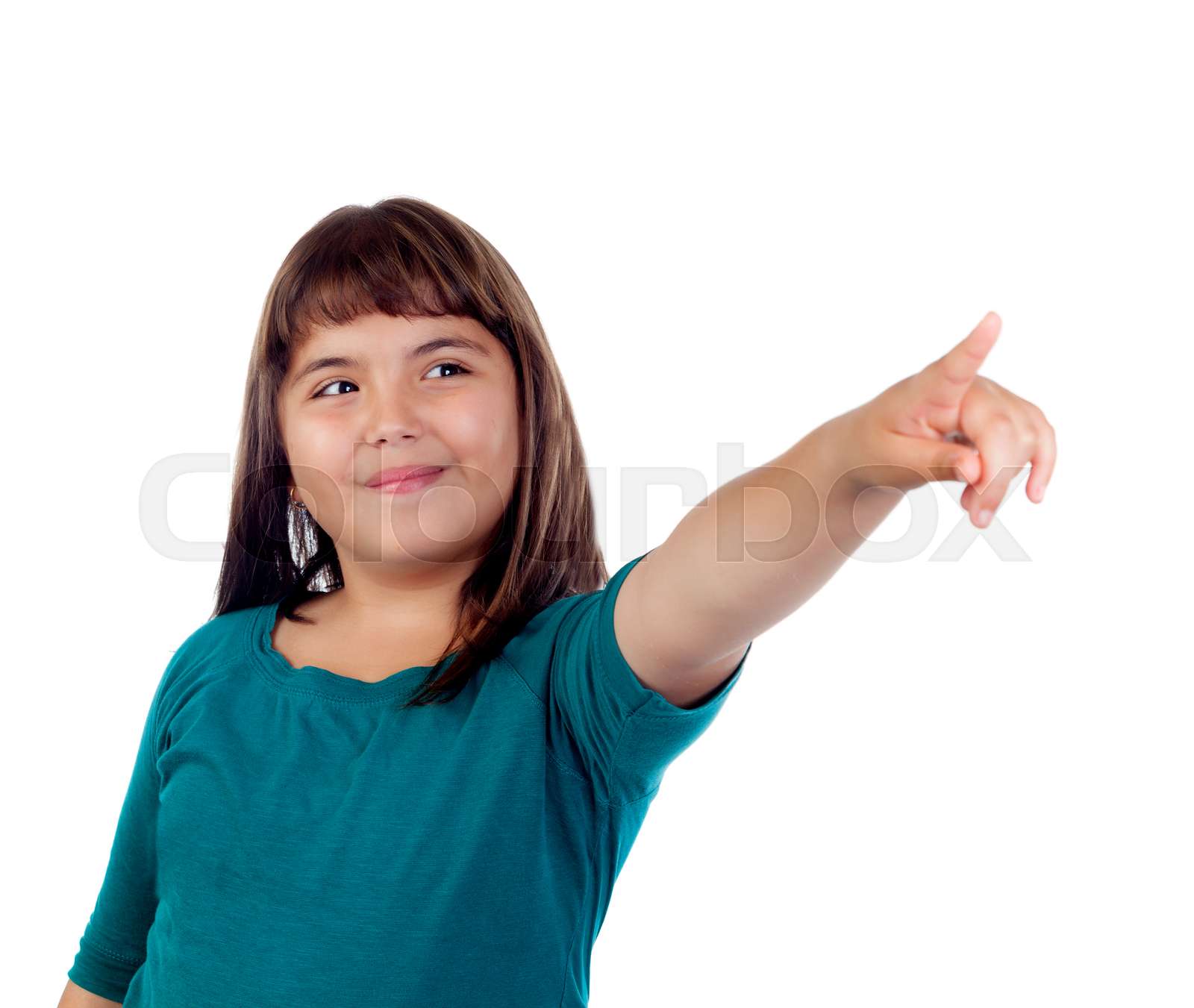 Beautiful girl indicating with his finger | Stock image | Colourbox