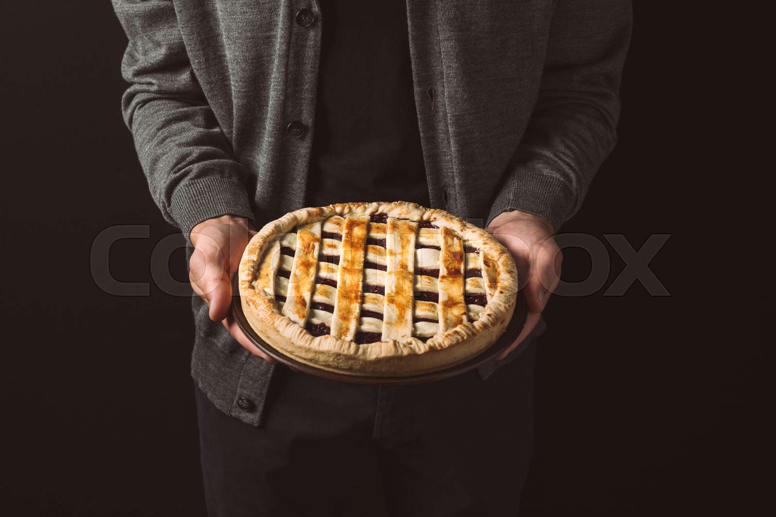 man holding homemade pie | Stock image | Colourbox