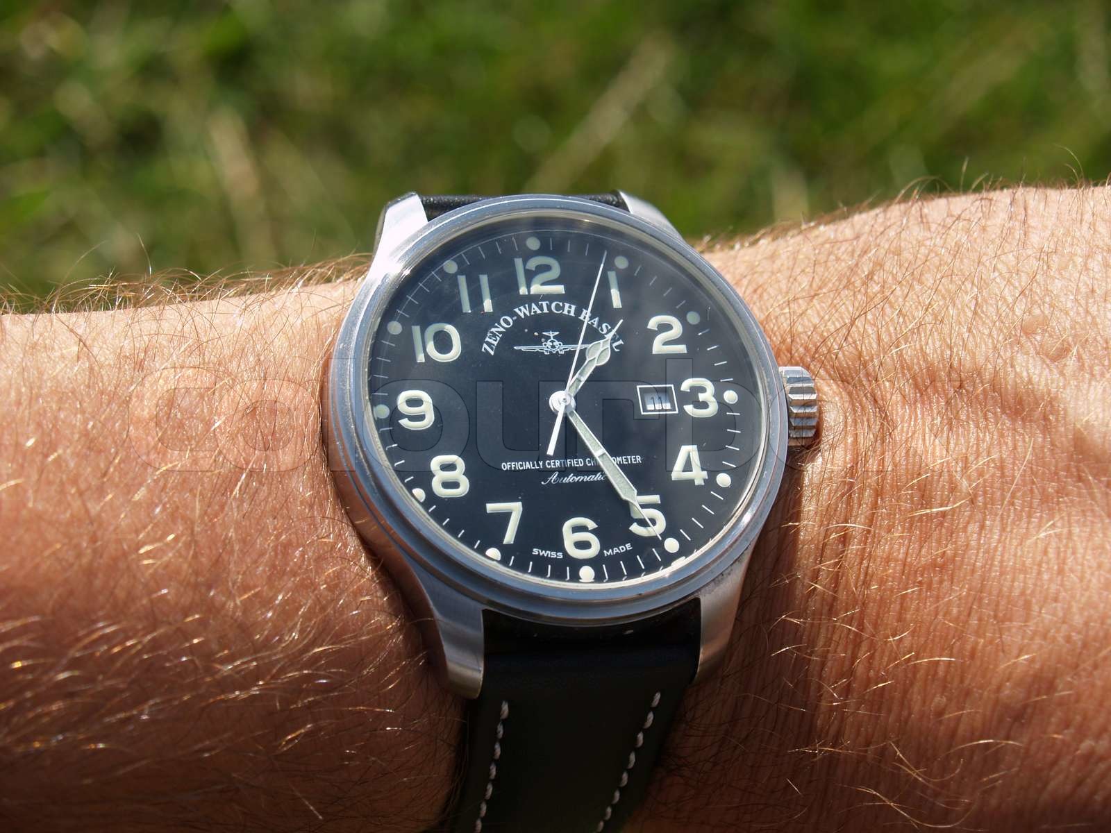 Large black watch on arm | Stock image | Colourbox