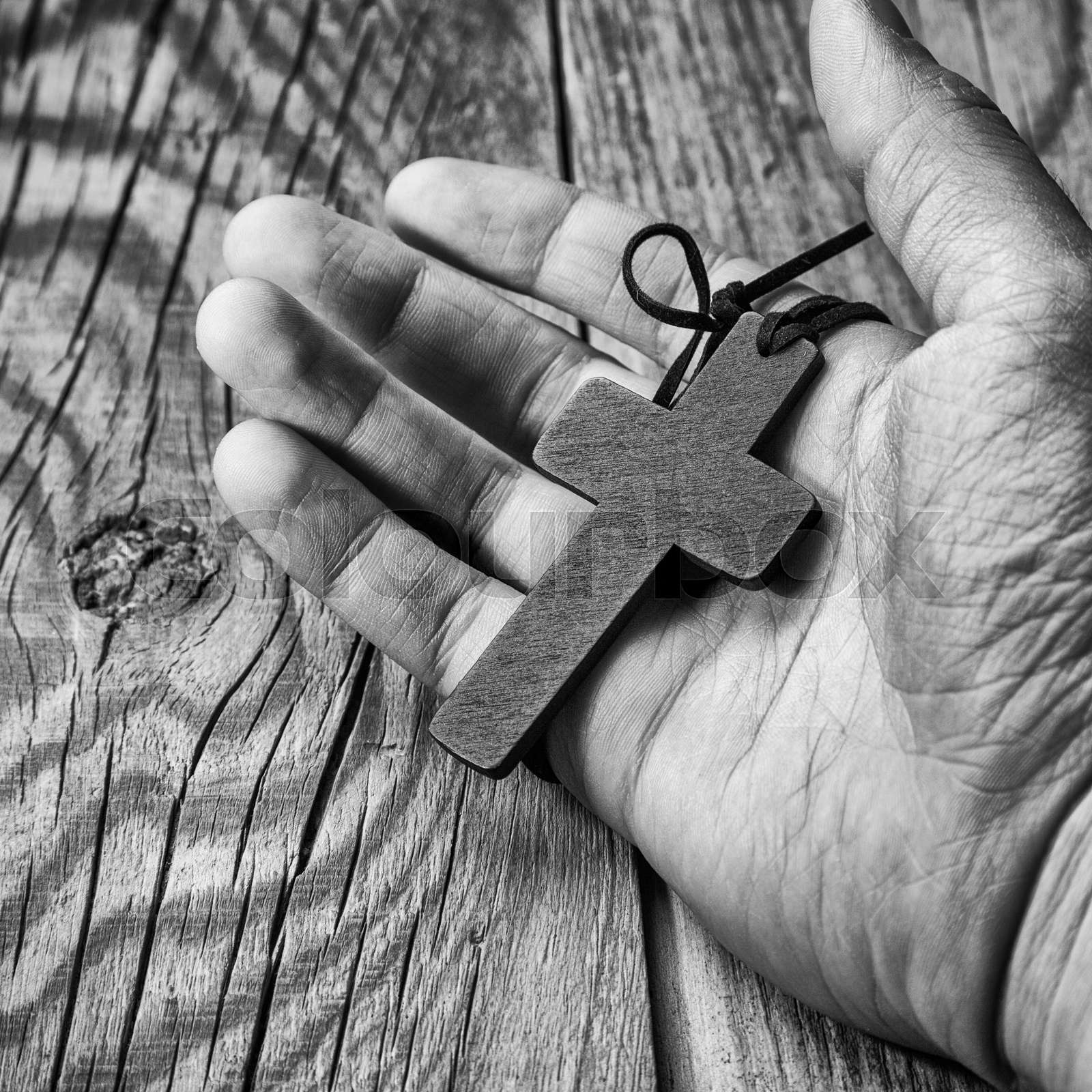 Cross in hand | Stock image | Colourbox