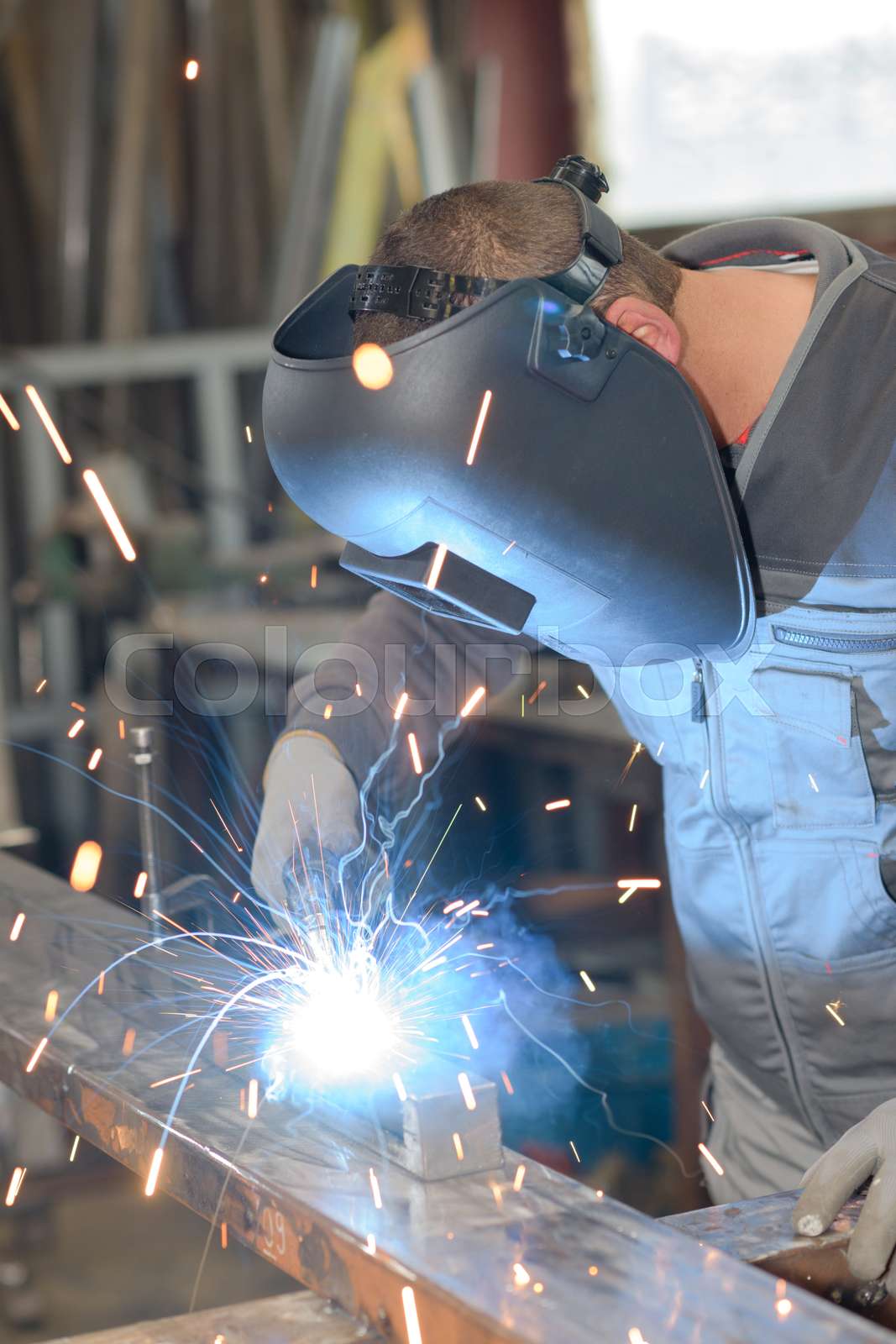 worker with protective mask welding metal - Stock Image - Everypixel
